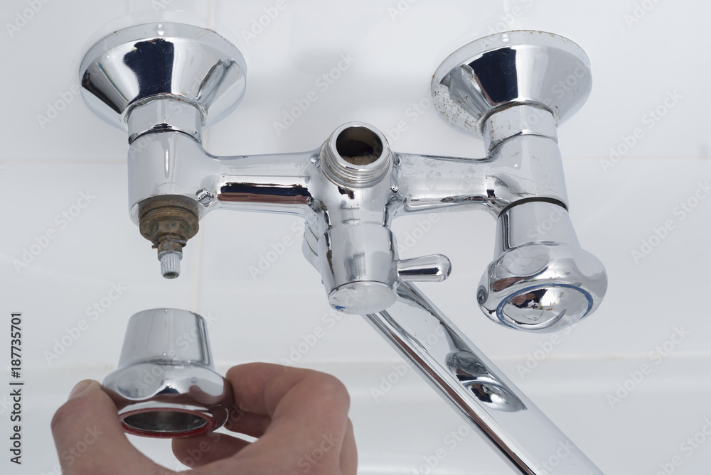 repair of a water tap Stock Photo | Adobe Stock