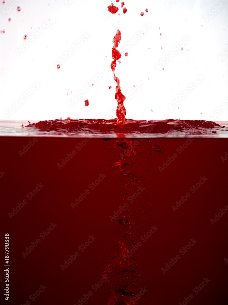 Red colour liquid dripping into water Stock Photo | Adobe Stock