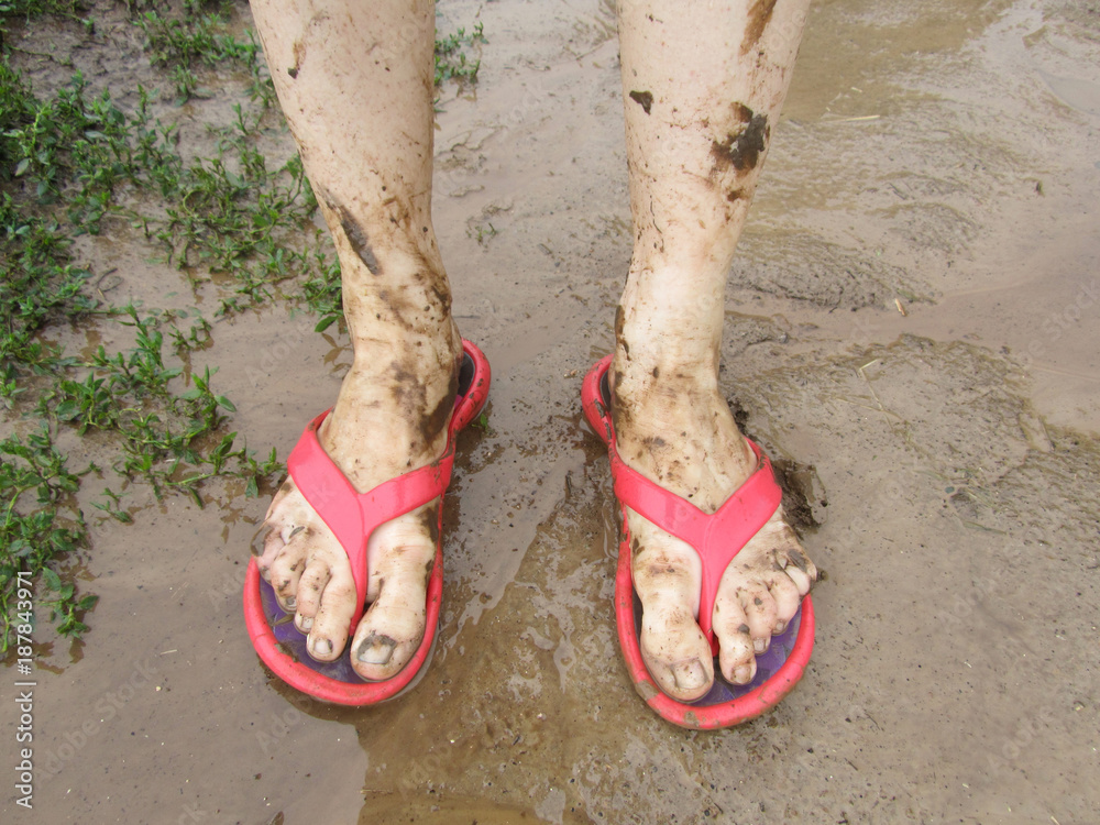 a woman stands in the mud. dirty feet. bad weather. Russia Stock Photo ...