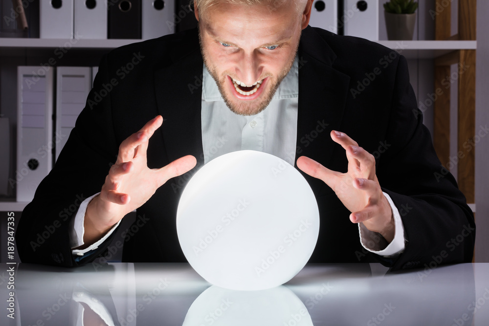 Man Looking Into Crystal Ball