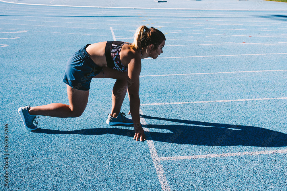 Athlete sprints on running track Stock Photo | Adobe Stock