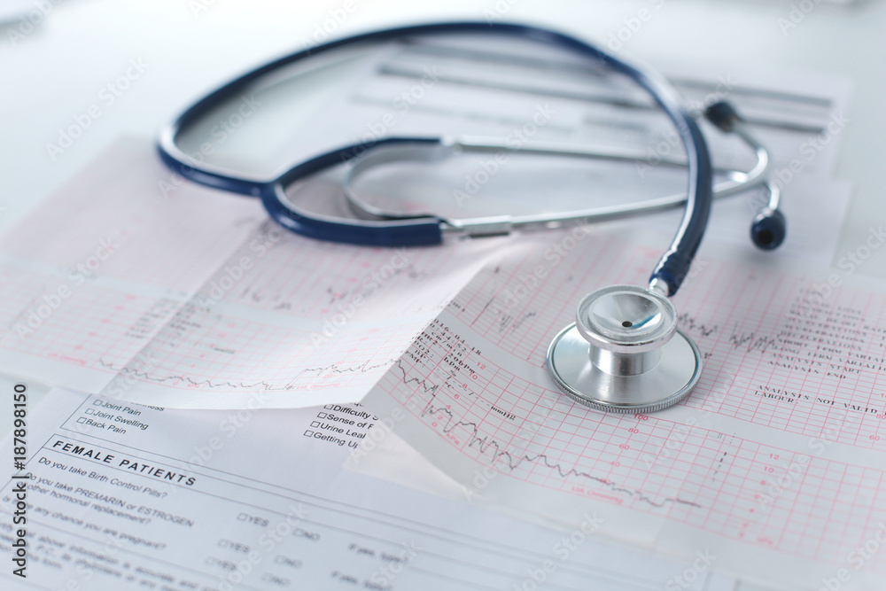 docter workplace with a stethoscope Cardiogram chart with medical table ...