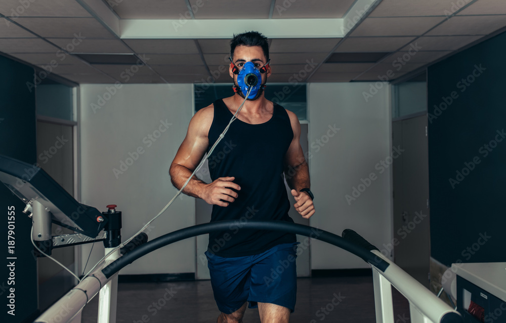 Runner testing his performance in sports science laboratory Stock Photo ...