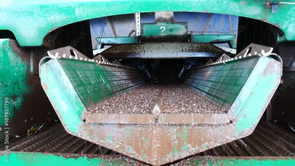 Shale shaker on an offshore oil rig separating the cutting from oil ...