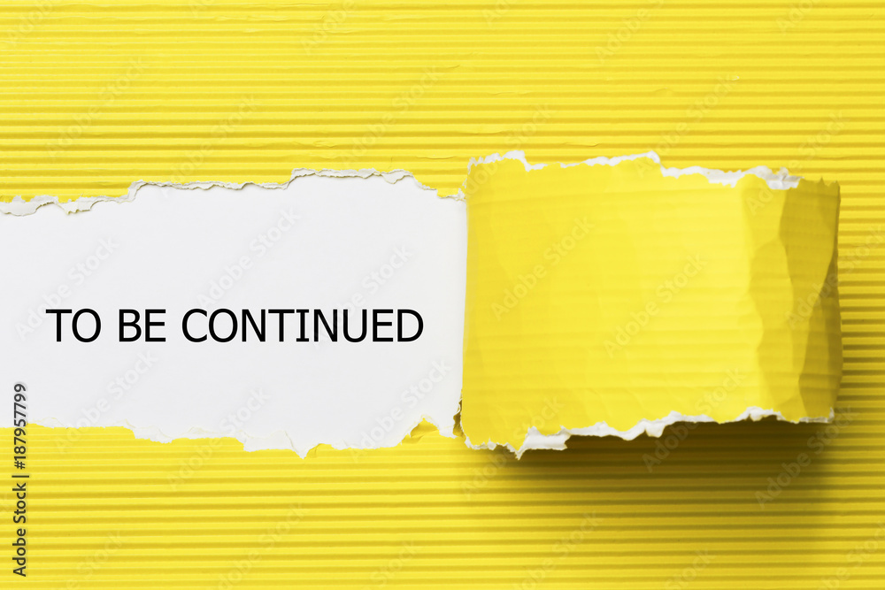 The text to be continued appearing behind torn paper Stock Photo ...