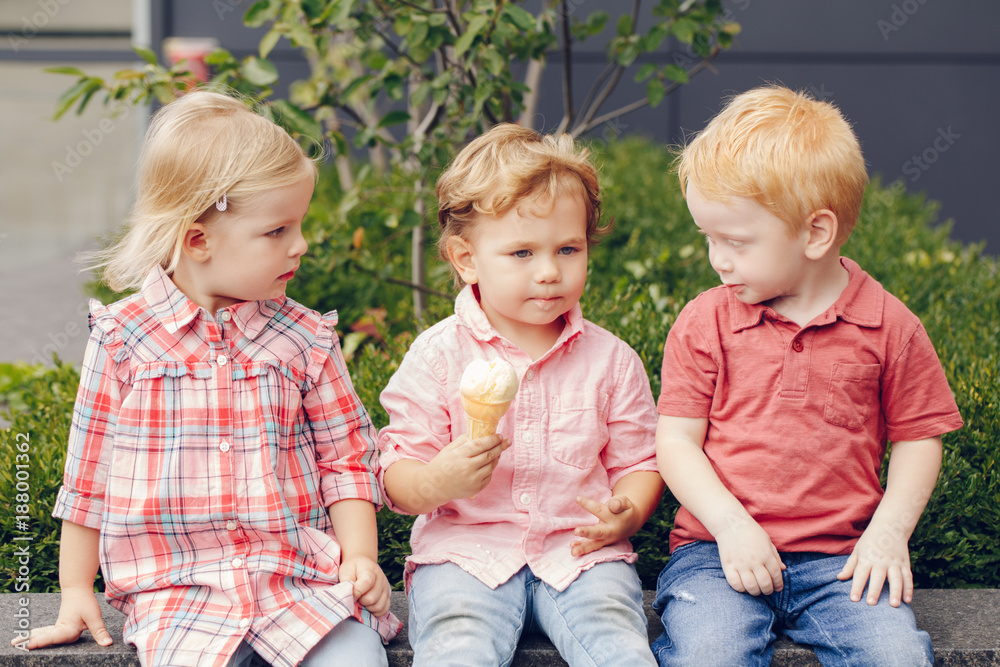 Foto de Group portrait of three white Caucasian cute adorable funny ...