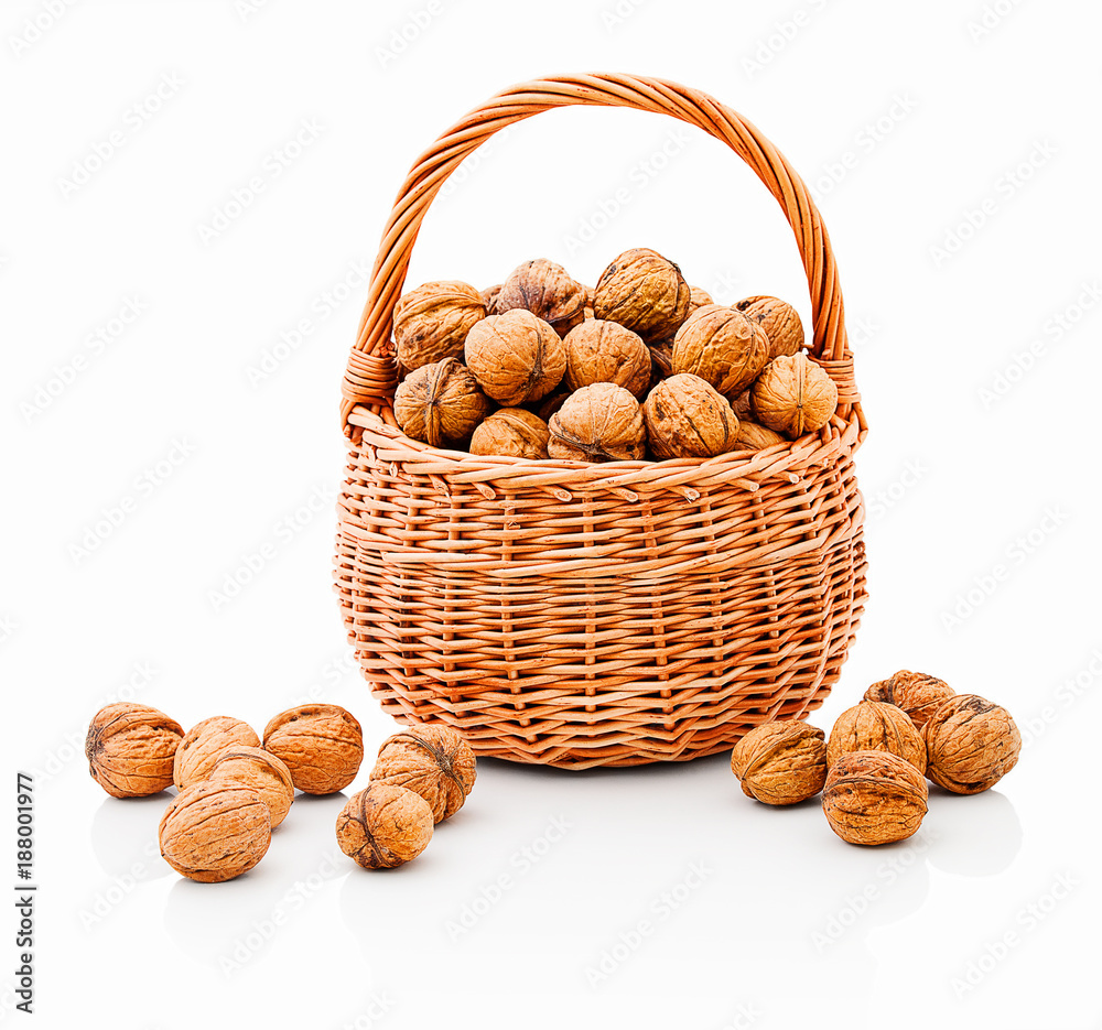 Wicker basket basketful of ripe bio walnuts. Rounded wattled basket ...