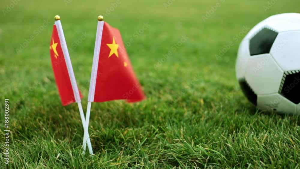 Flag of China and football ball on the lawn. Chinese flag and soccer ...