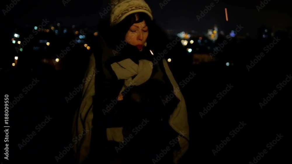 Hobo young girl frizzing at cold city night at bonfire lowlight close ...