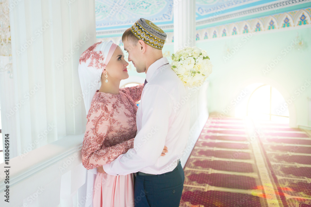 Muslim bride and groom at the mosque. Wedding ceremony Stock Photo ...