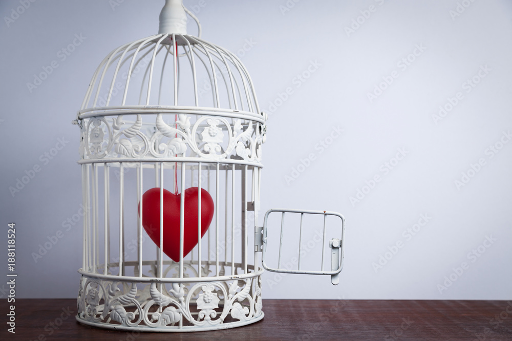Red heart in an open cage Stock Photo | Adobe Stock