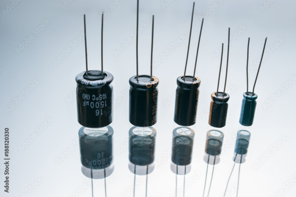 bipolar electric capacitors on white background. microelectronic ...