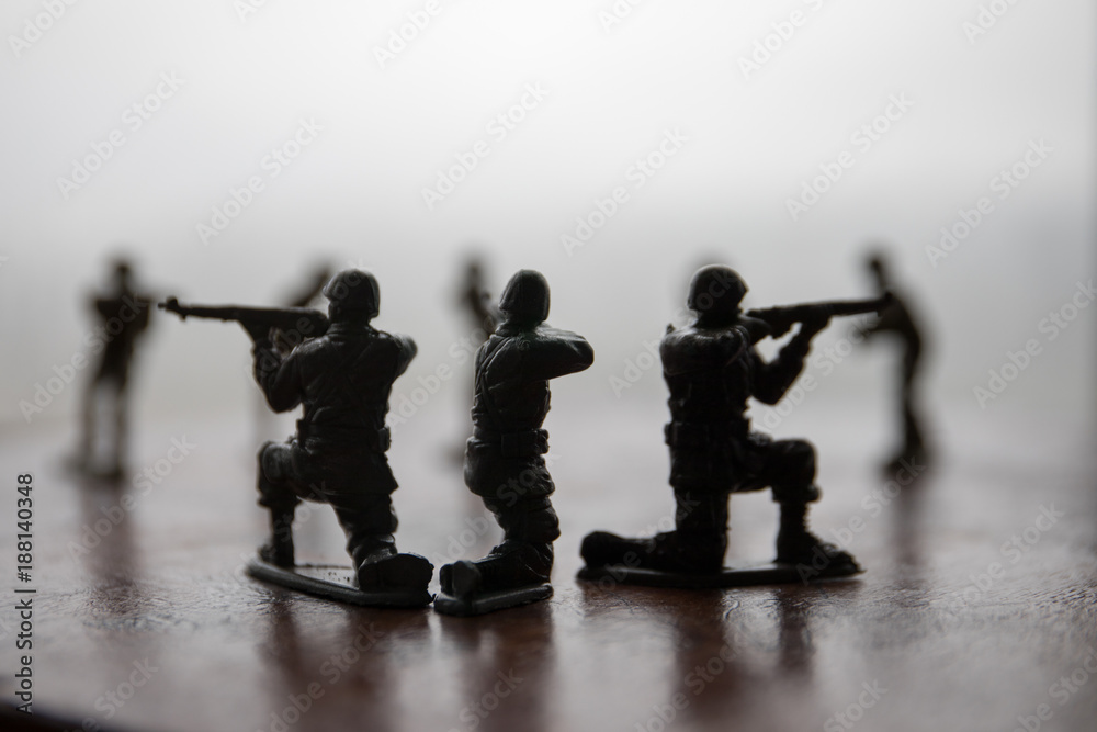miniature toy soldiers and tank on board. Close up image of toy ...