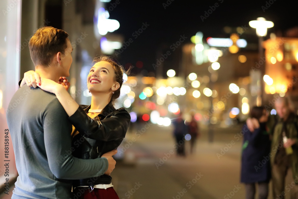 Beautiful couple on a date in a night city Stock Photo | Adobe Stock