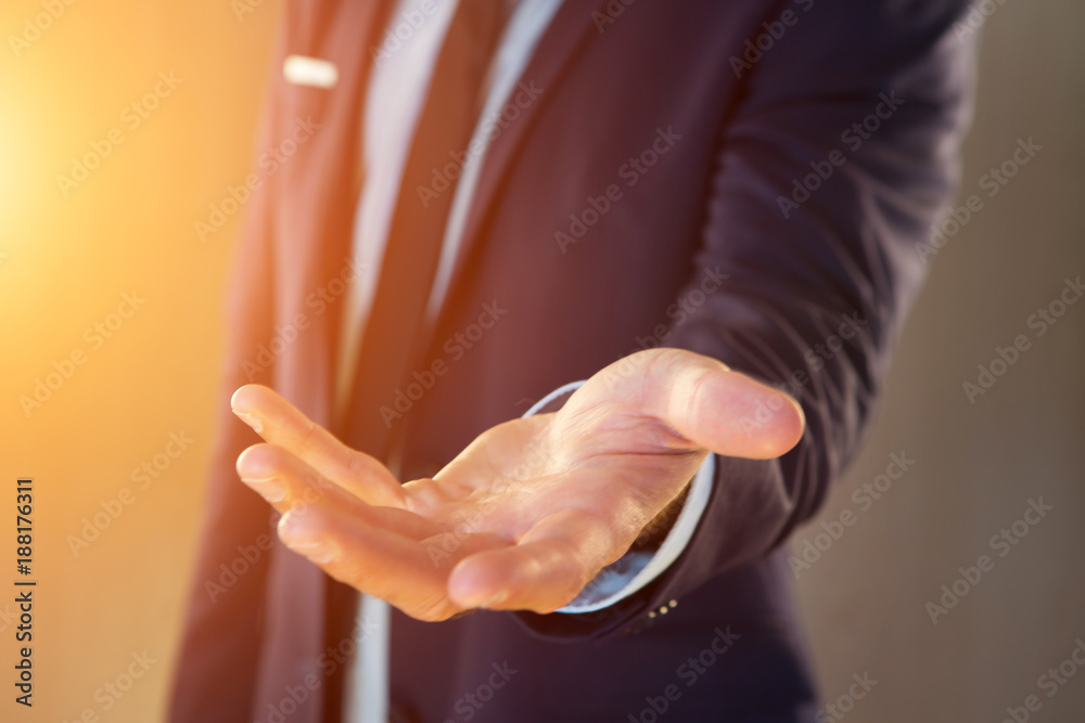Businessman giving an empty hand on a color background Stock Photo ...