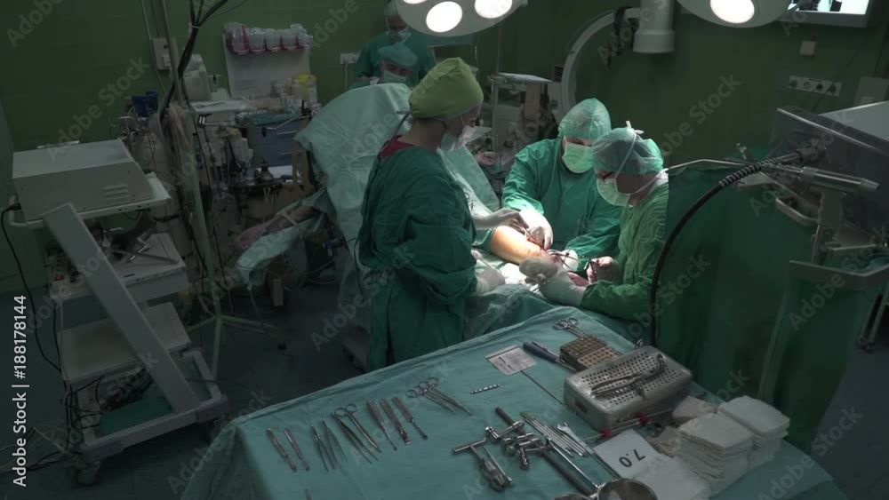 Teamwork of orthopedic senior surgeons and nurse during surgical ...
