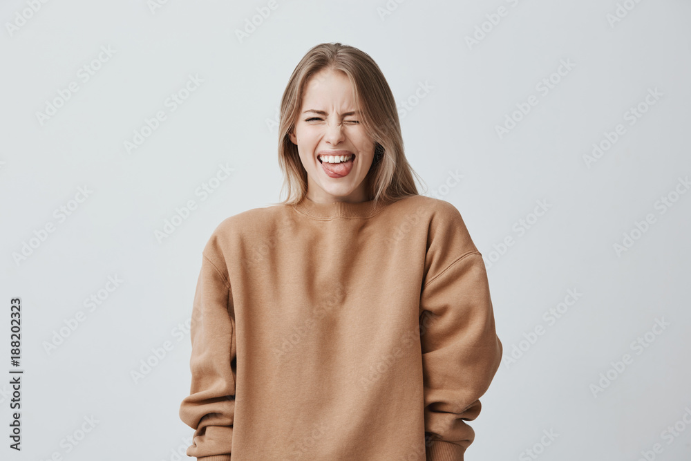 Body language. Disgusted stressed out pretty girl with straight fair ...