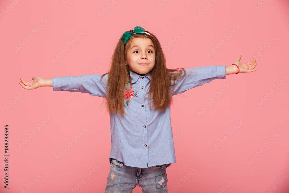 Lovely child girl in hair hoop and casual clothes giving huge hug with ...