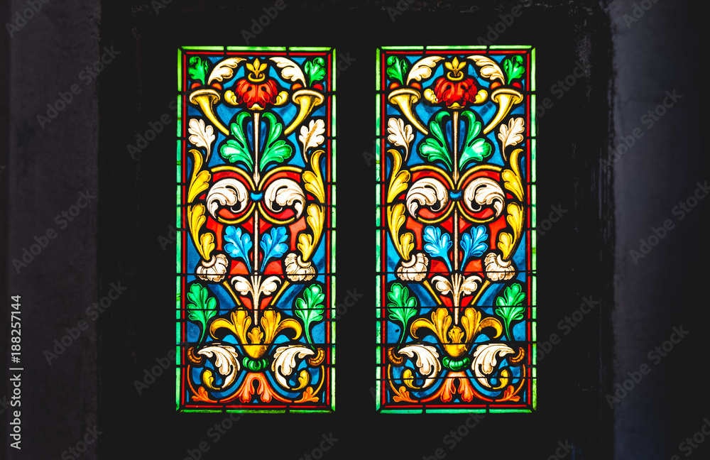 coloured stained glass in dark background Stock Photo | Adobe Stock