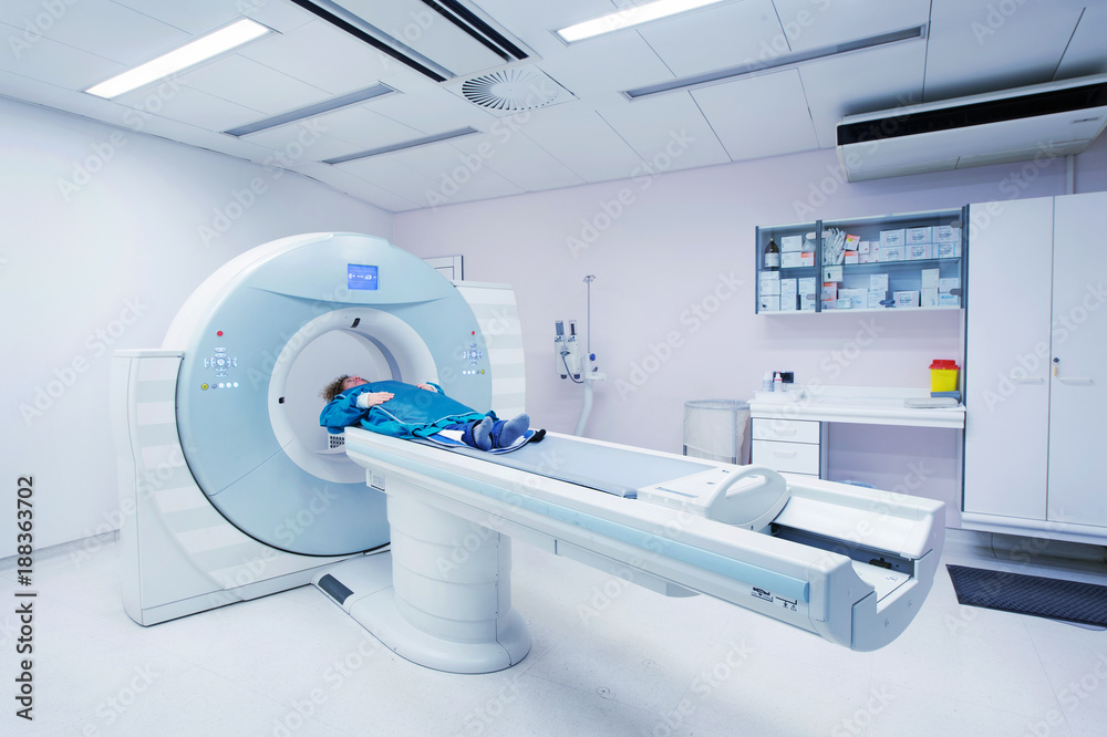 Female patient undergoing CT - Computerized Tomography Scan in Hospital ...