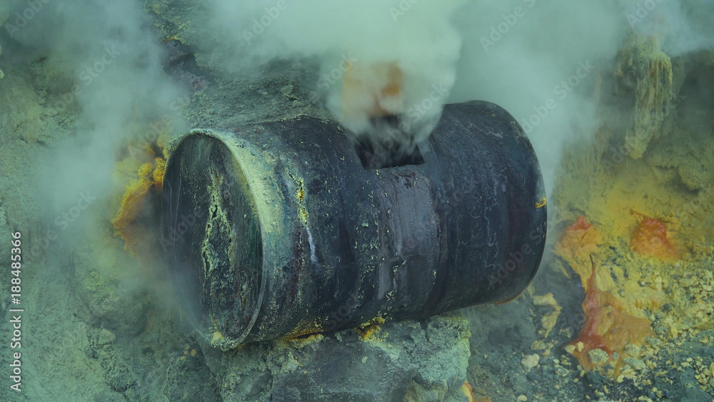 Extraction of sulfur in the crater of a volcano. Sulfur gas, smoke ...