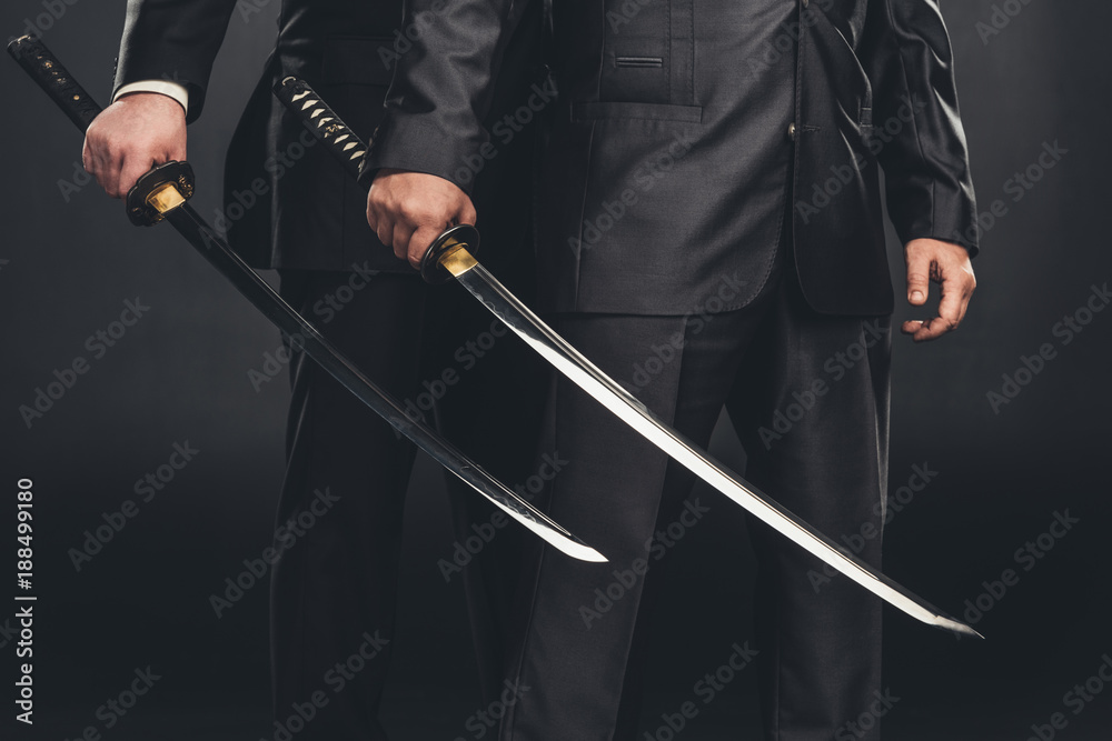 cropped shot of modern samurai with katana swords isolated on black ...