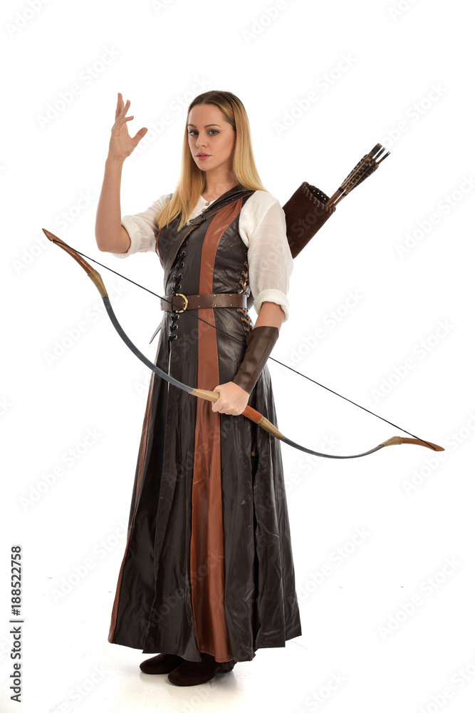 full length portrait of girl wearing brown fantasy costume, holding a ...