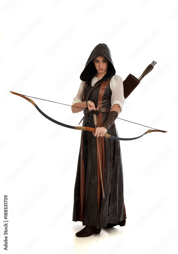 full length portrait of girl wearing brown fantasy costume, holding a ...