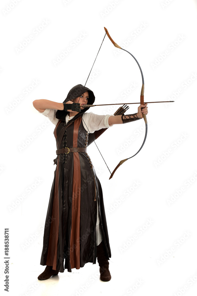 full length portrait of girl wearing brown fantasy costume, holding a ...