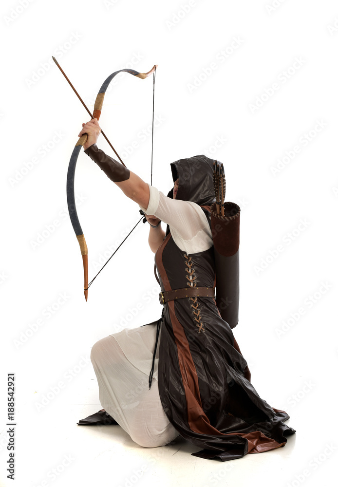 Full Length Portrait Of Girl Wearing Brown Fantasy Costume Holding A