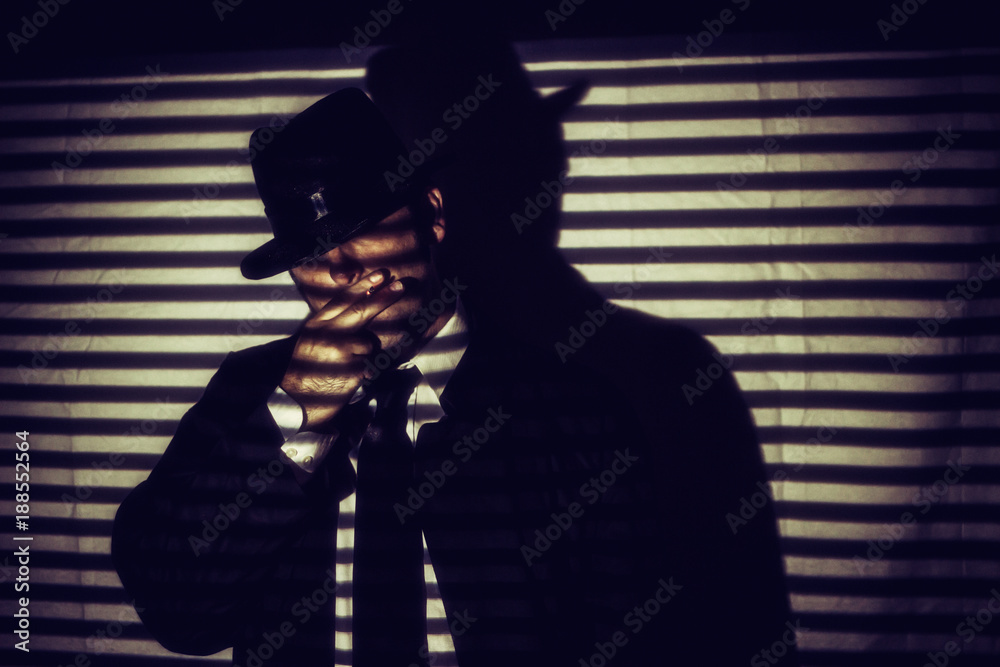 Film Noir Man Smoking Cigarette Shadows. Man in white shirt, black tie ...