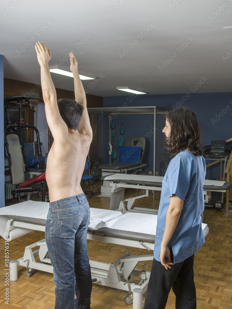 Foto de Chiropractor doing a visual exploring, static, dynamic position ...