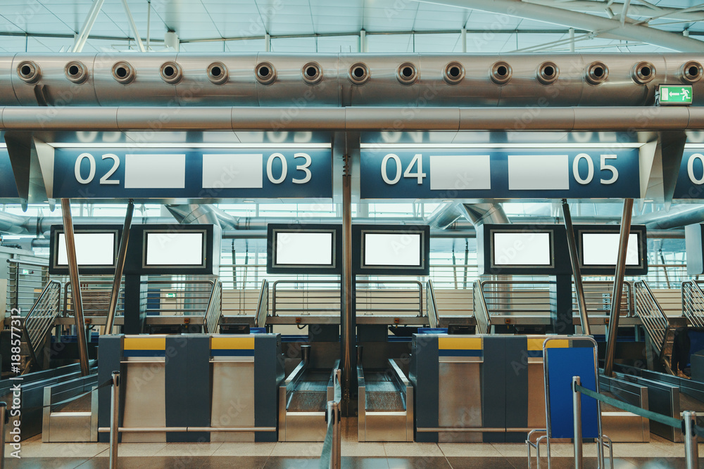 Check-in area in modern airport: luggage accept terminals with baggage ...