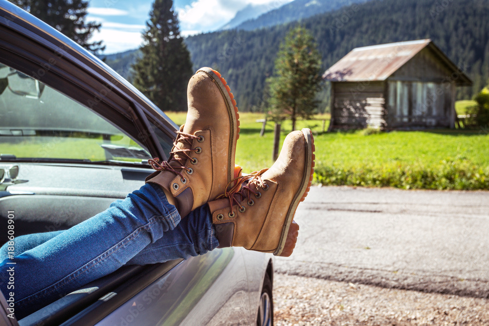 Girl legs sticking out of the car Stock Photo | Adobe Stock