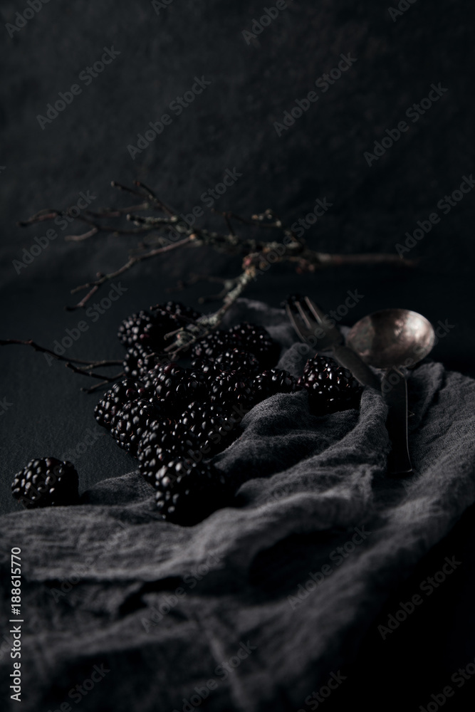 monochrome food picture of blackberries on a napkin and slate plate ...