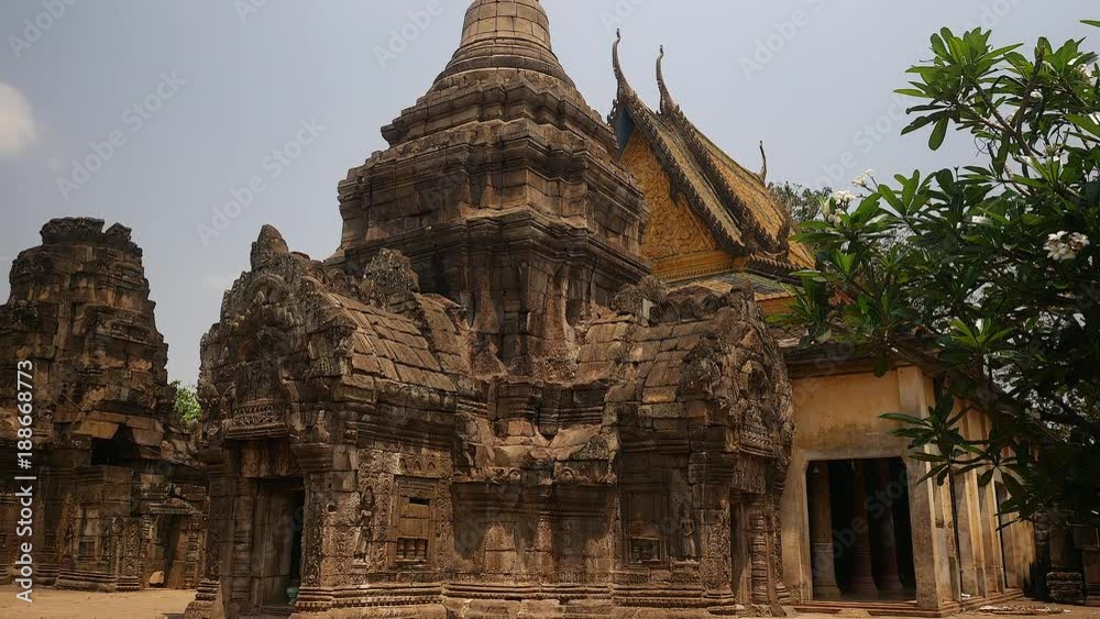 Tilt down to an old temple made of sandstone and laterite. This temple ...