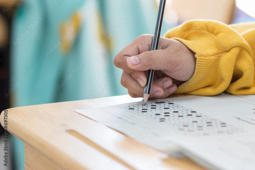 high school or university student hands taking exams, writing ...