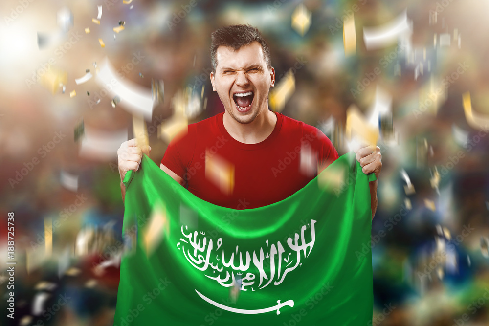 Saudi Arabia is a fan, a fan of a man holding the national flag of ...