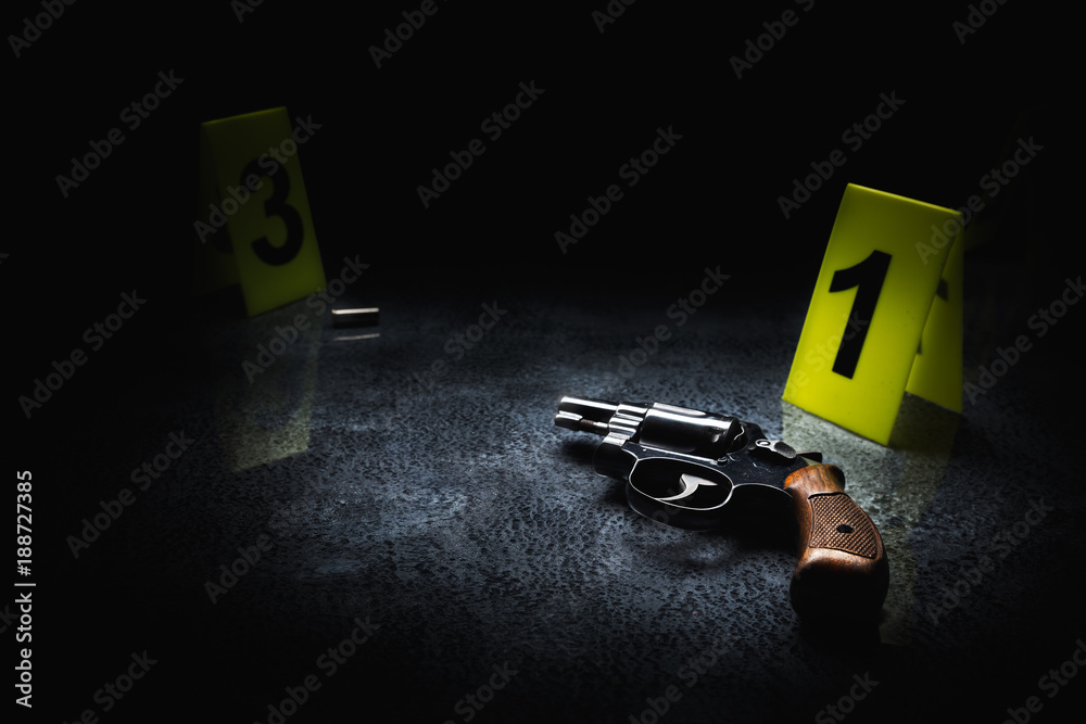 Crime scene concept with a gun and evidence markers, high contrast ...