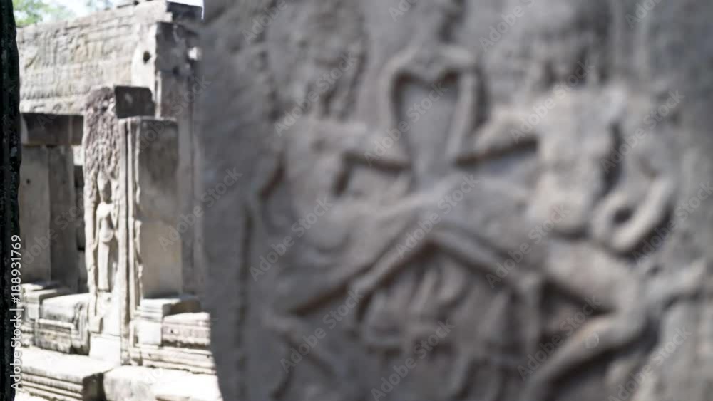 Steadicam dolly motion to left of apsara dancers sculpted into the ...