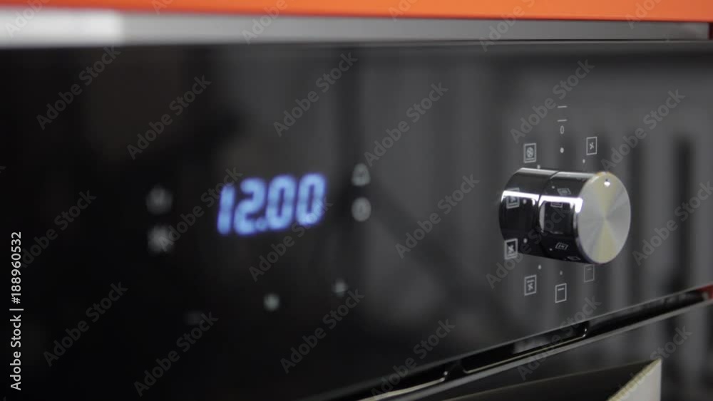 Metallic Toggle Switch of the Cooker Oven. Close-up View. Digital Clock ...
