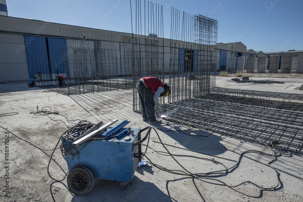 Man makes rebar welds on internal structures Stock Photo | Adobe Stock