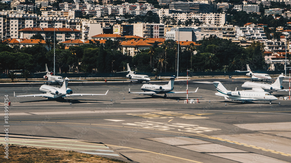 Aerial view of planes and private jets in the Nice airport. France. Top ...