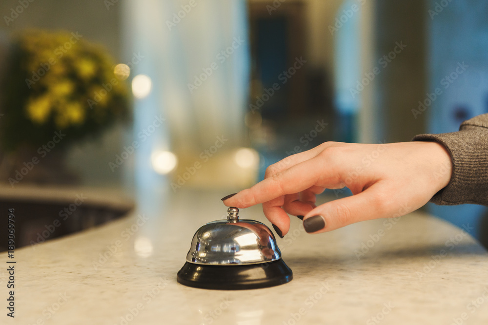 Woman ringing hotel reception service bell closeup Stock Photo | Adobe ...