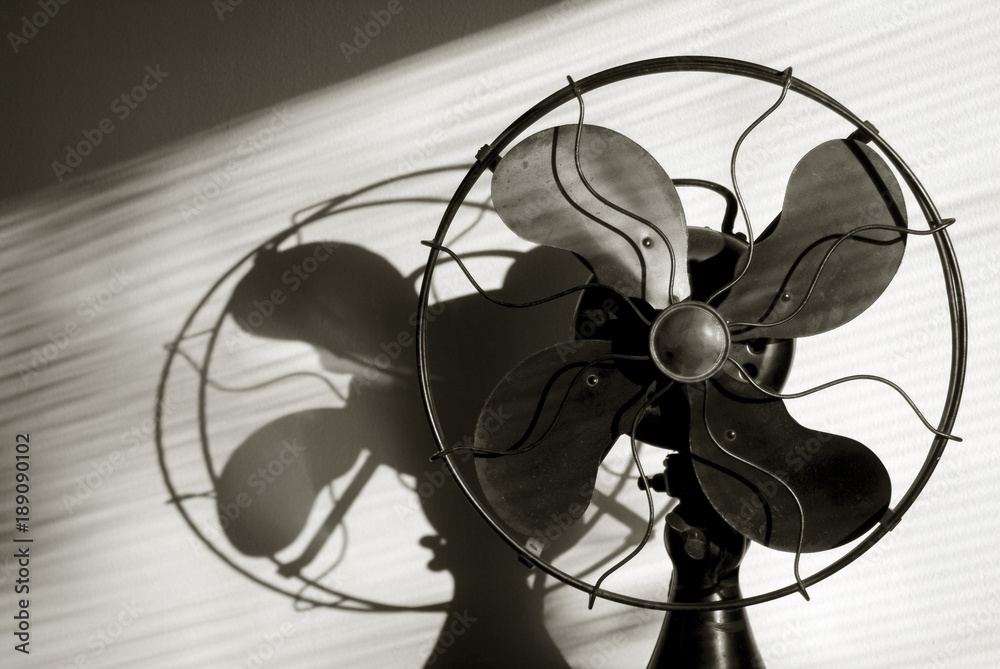Antique Fan With Light Streaming Through the Window Blinds. A film noir ...