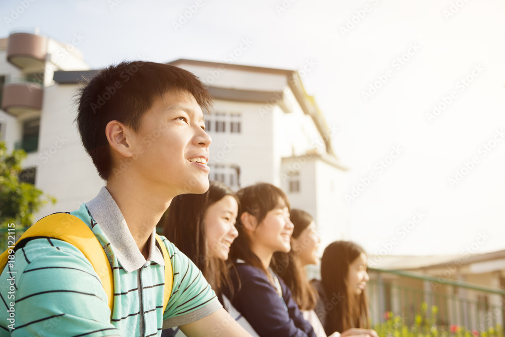 Group Of Teenage Students sitting in school Stock Photo | Adobe Stock