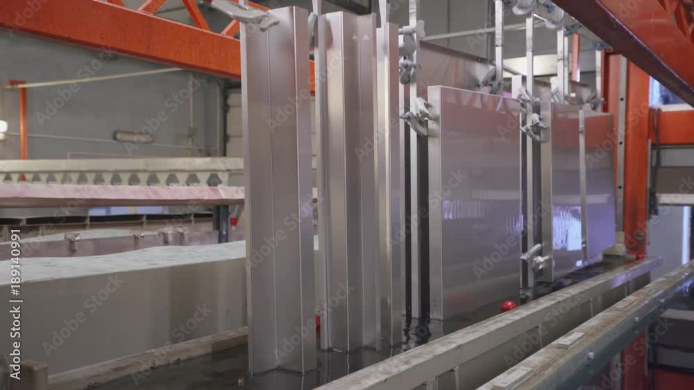 Manufacture. Process of anodizing aluminum plates in production ...