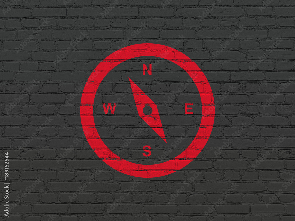 Vacation concept: Painted red Compass icon on Black Brick wall ...