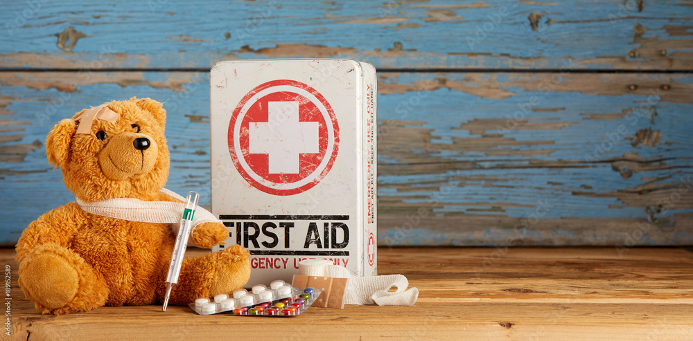 Cute little teddy bear receiving First Aid Stock Photo | Adobe Stock