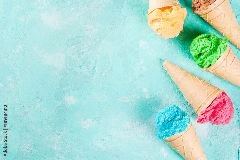 Selection of various bright multicolored ice-cream in ice cream cones ...